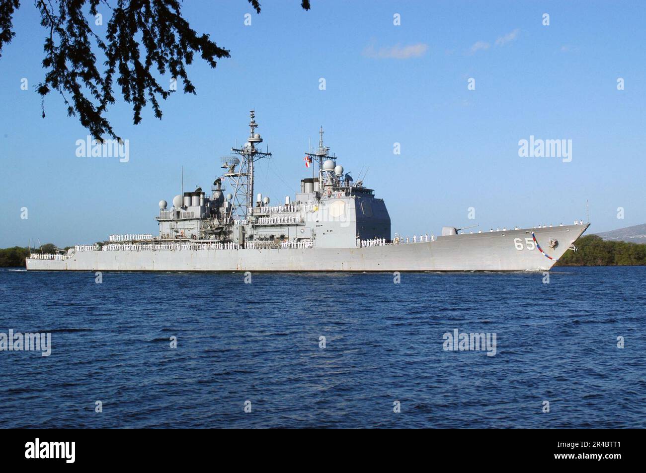 US Navy Sailors aboard USS Chosin (CG 65) man the rails as they return ...