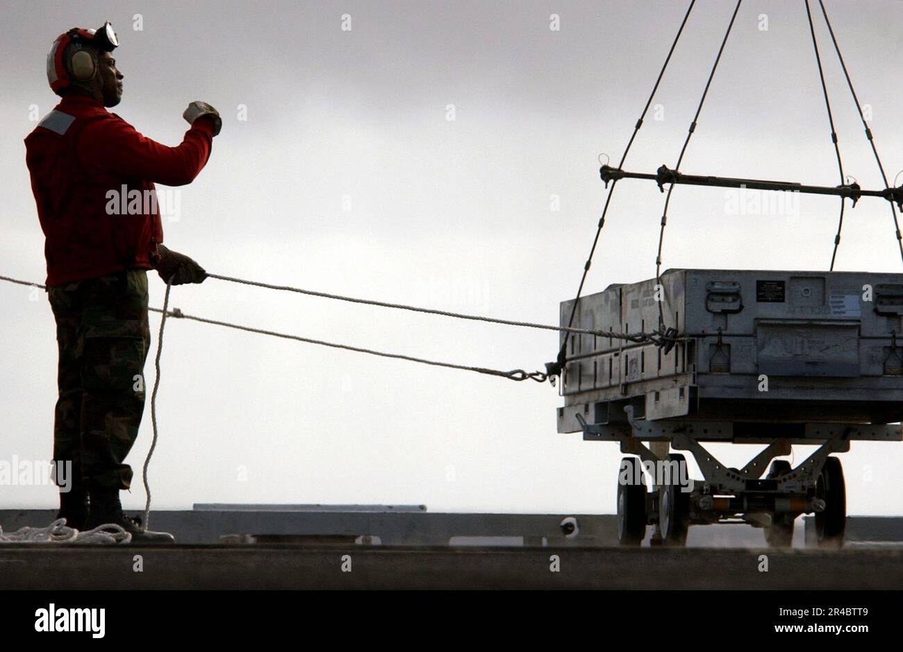 US Navy A Fire Controlman steadies a Rolling Airframe Missile (RAM ...