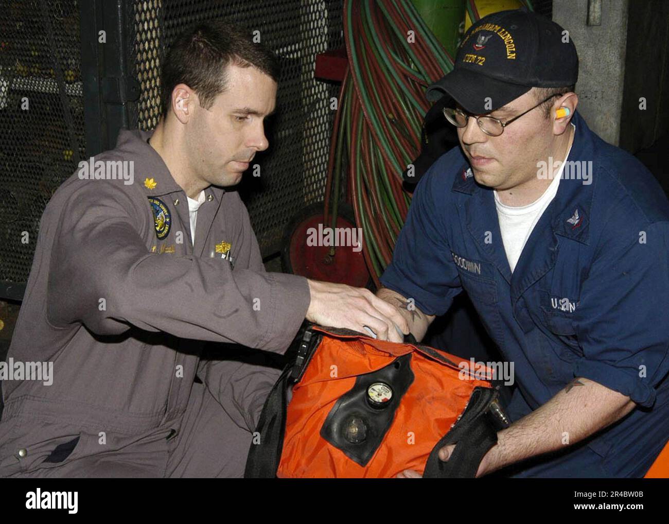 US Navy A member of an Inspection Survey (INSURV) team checks the ...