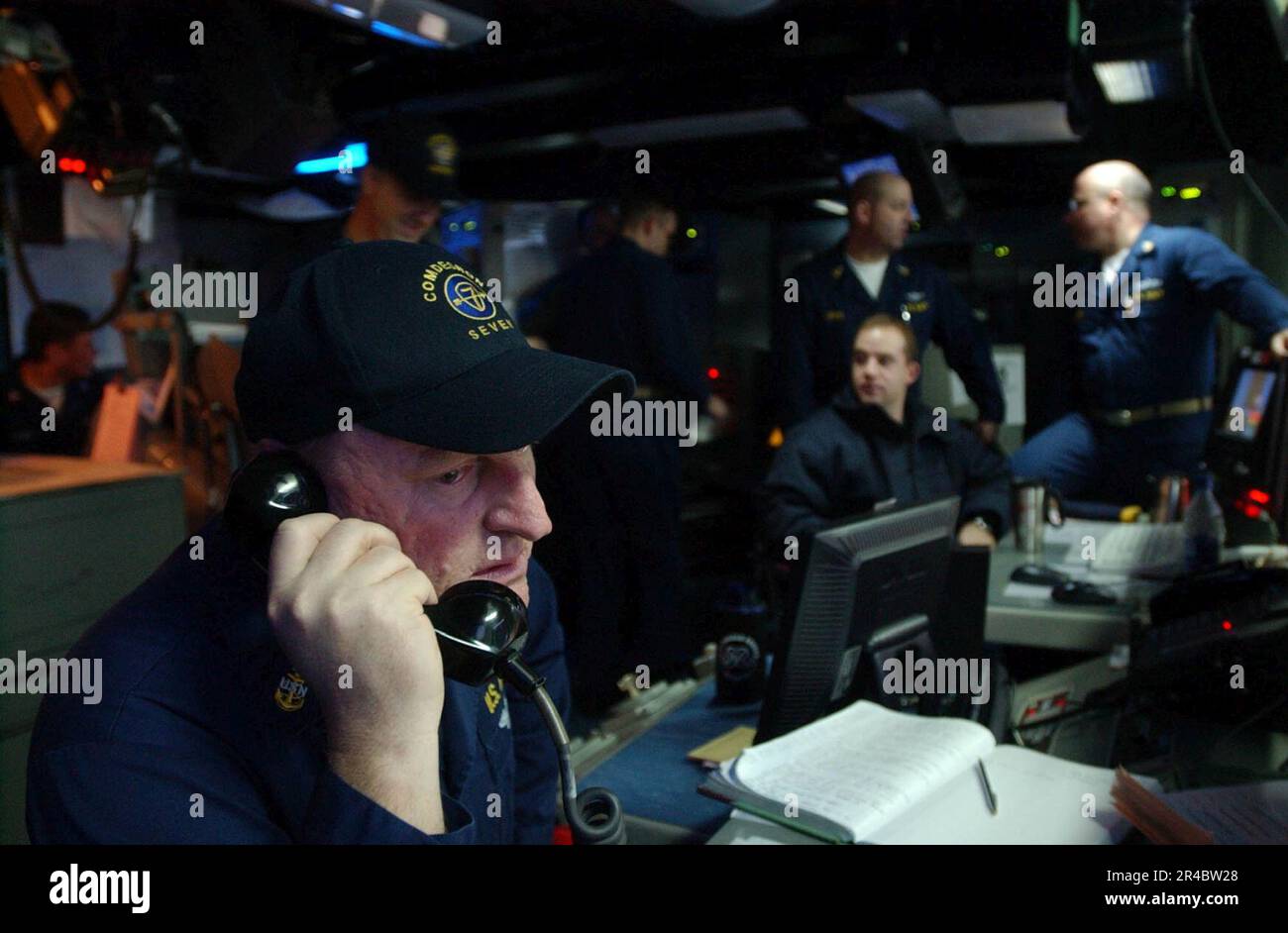 US Navy Senior Chief Fire Controlman communicates with the guided ...