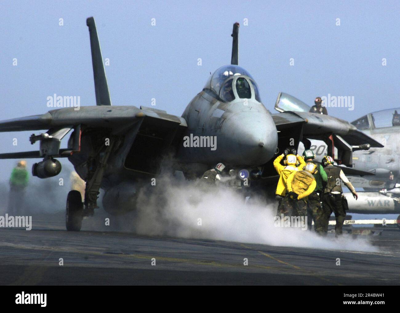 US Navy An F-14D Tomcat is directed to the catapult in preparation to ...
