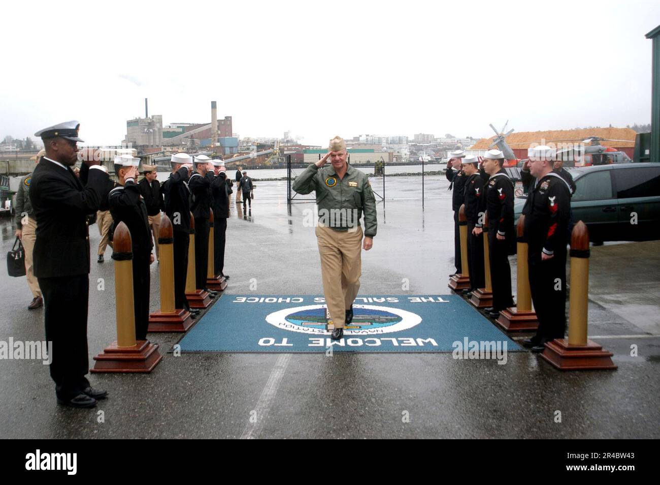 US Navy Commander, U.S. Pacific Fleet, Adm. Gary Roughead, renders a ...