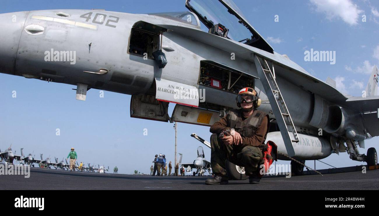 US Navy A plane captain assigned to the Golden Warriors of Strike ...