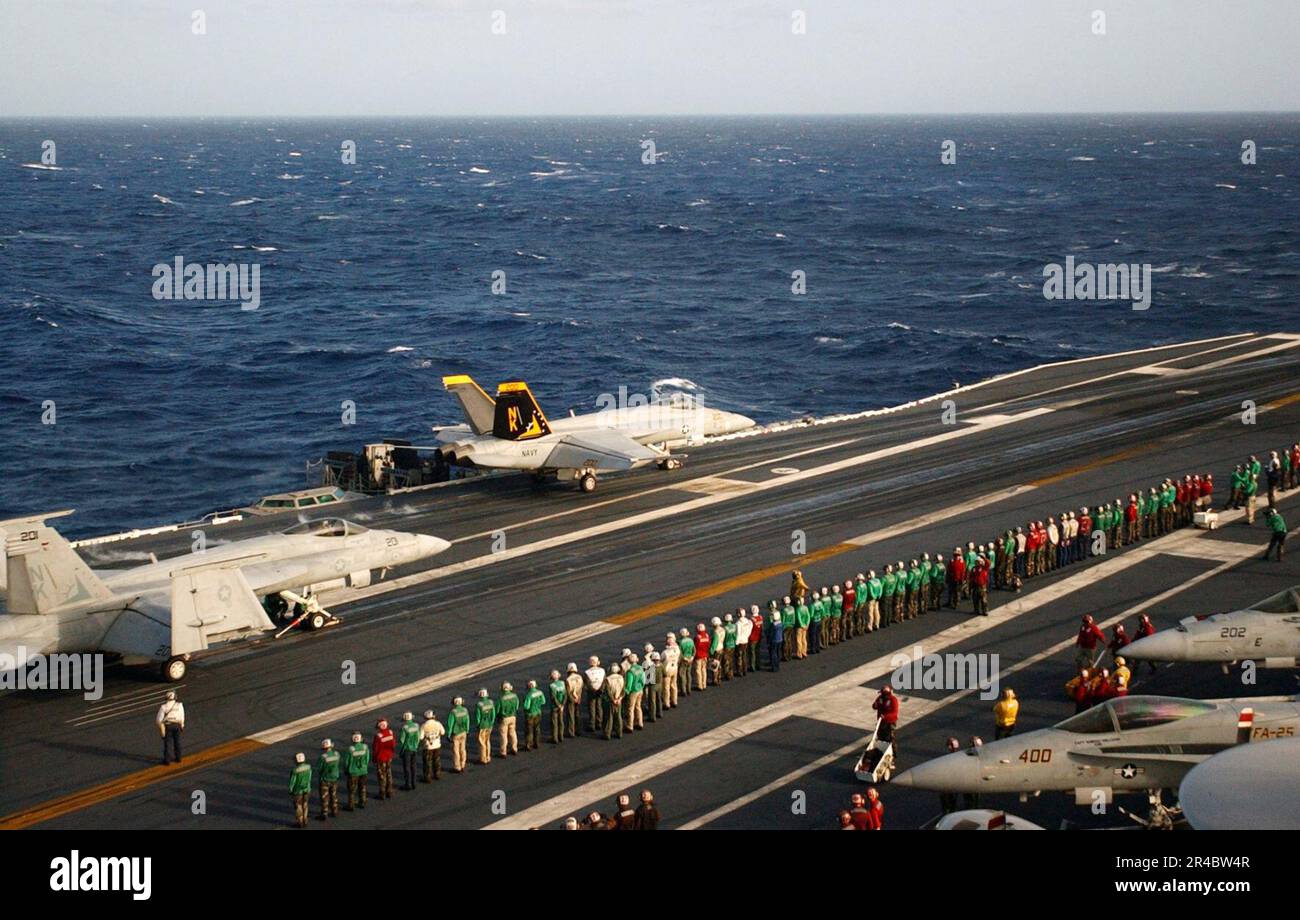US Navy Cmdr. launches from the flight deck aboard the Nimitz-class ...