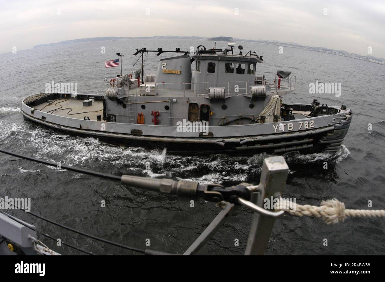 US Navy A Yokosuka Naval tugboat (YTB 782) prepares to assist the guided missile destroyer USS ...