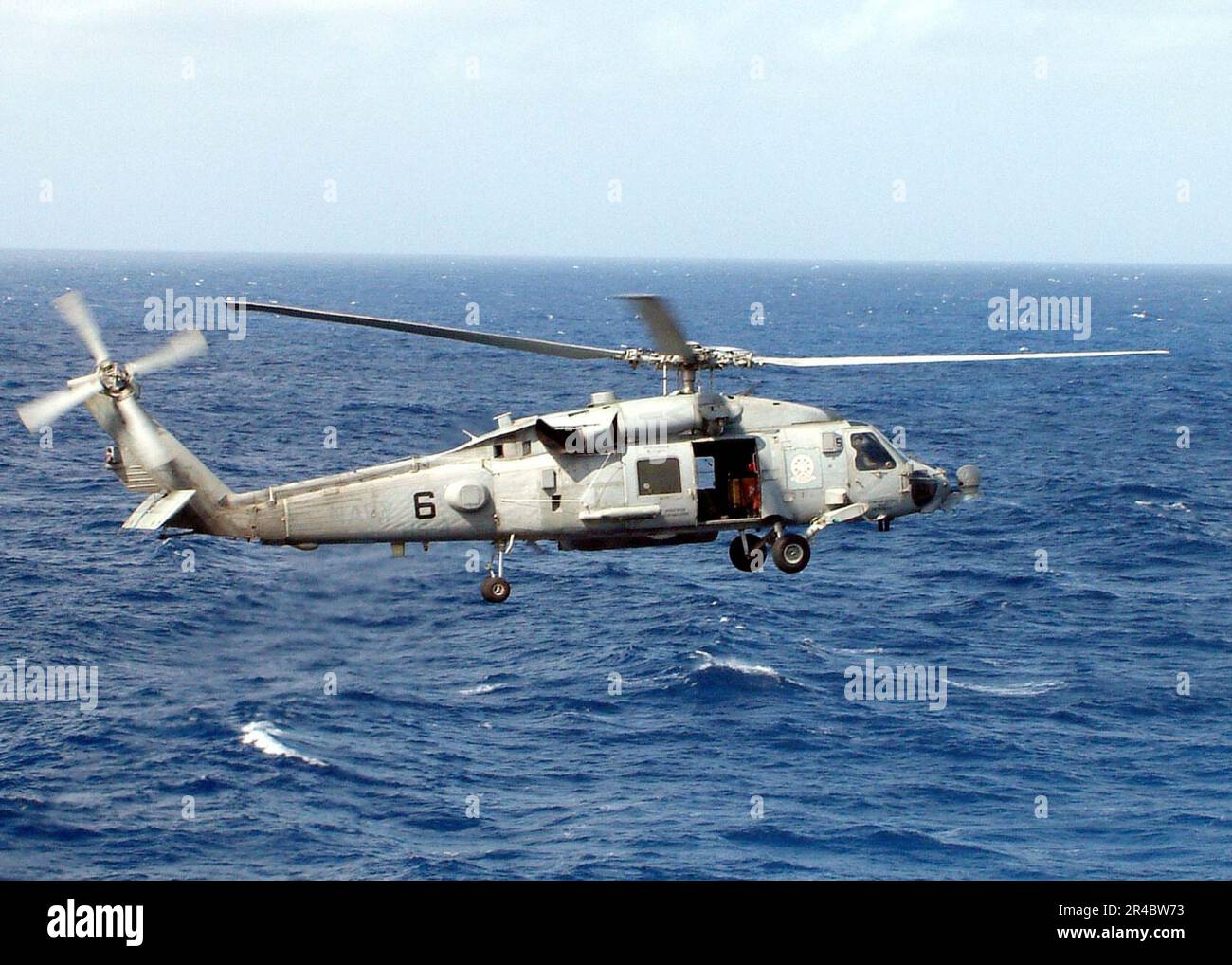 US Navy A HH-60H Seahawk helicopter takes part in Anti-Submarine Warfare exercises off the coast ...