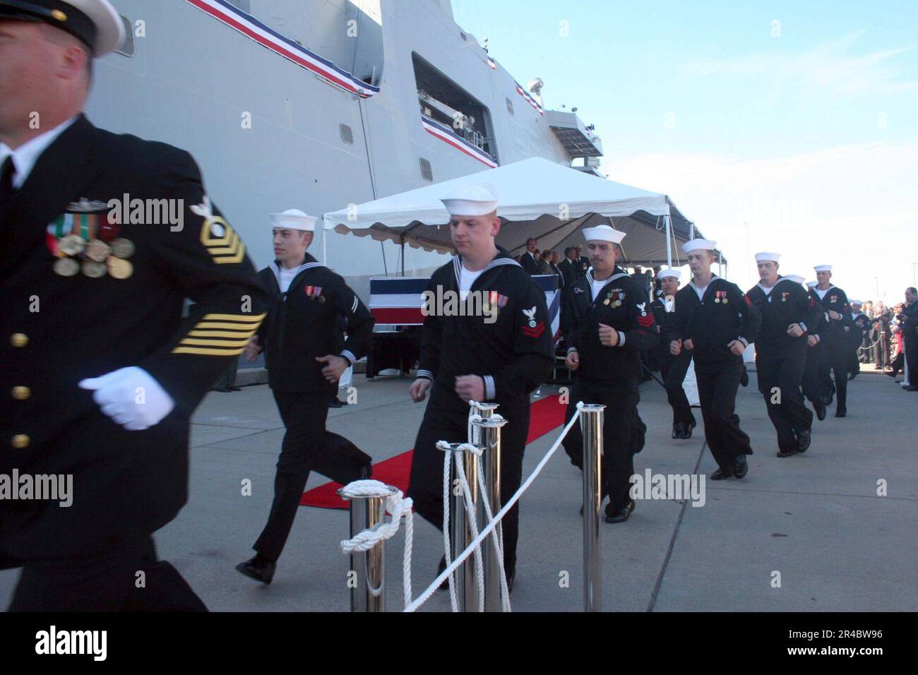 US Navy Sailors assigned to USS San Antonio (LPD 17) man the ship ...