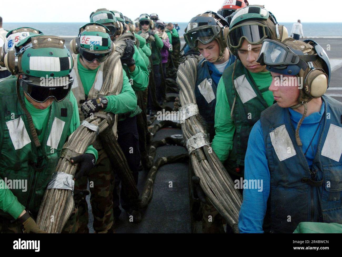 US Navy Crew members aboard Nimitz-class aircraft carrier USS Ronald ...