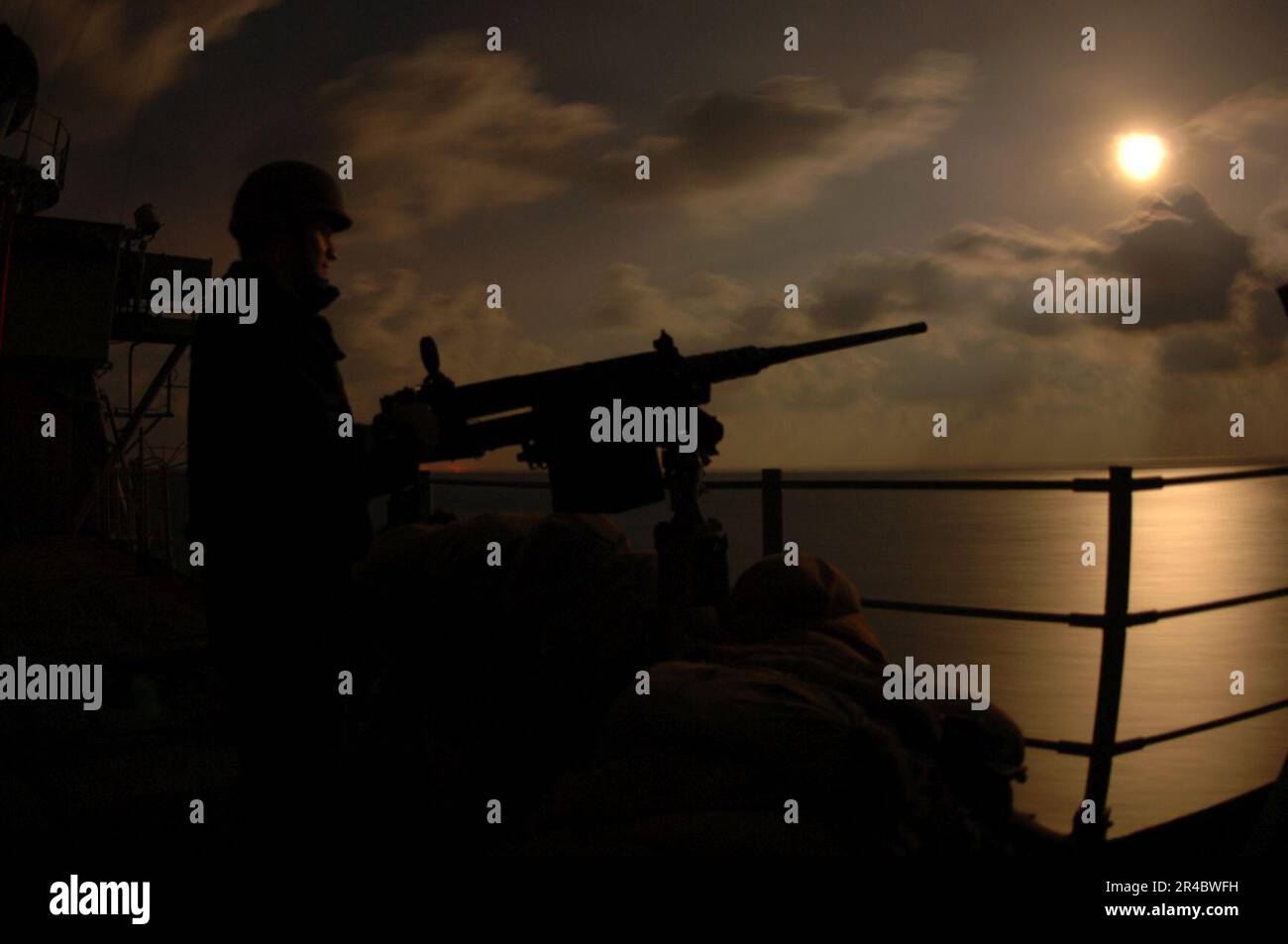 US Navy Personnel Specialist 2nd Class stands watch at one of the .50 ...