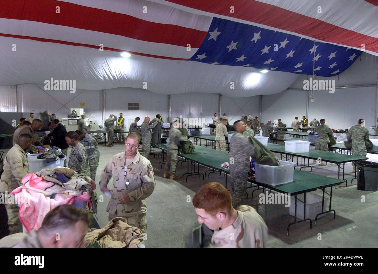 US Navy Soldiers repack their bags after having them inspected in the ...