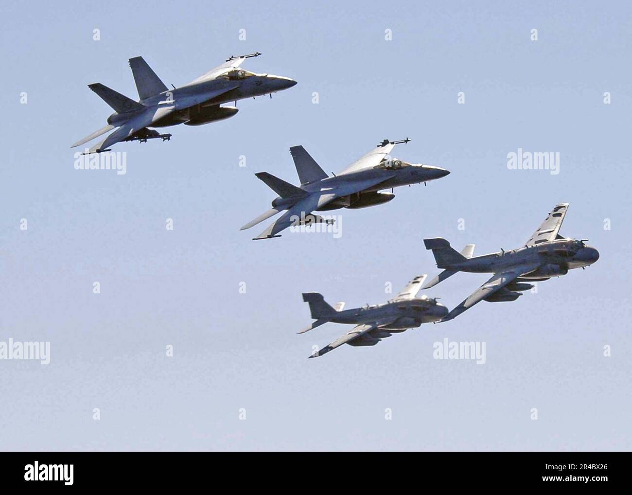 US Navy Two F-A-18E Super Hornets and two EA-6B Prowlers fly near the ...