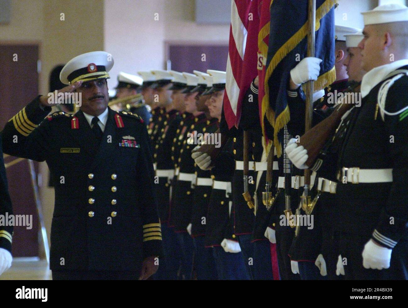 US Navy Commander, Royal Bahrain Navy, Col. conducts a troop inspection ...