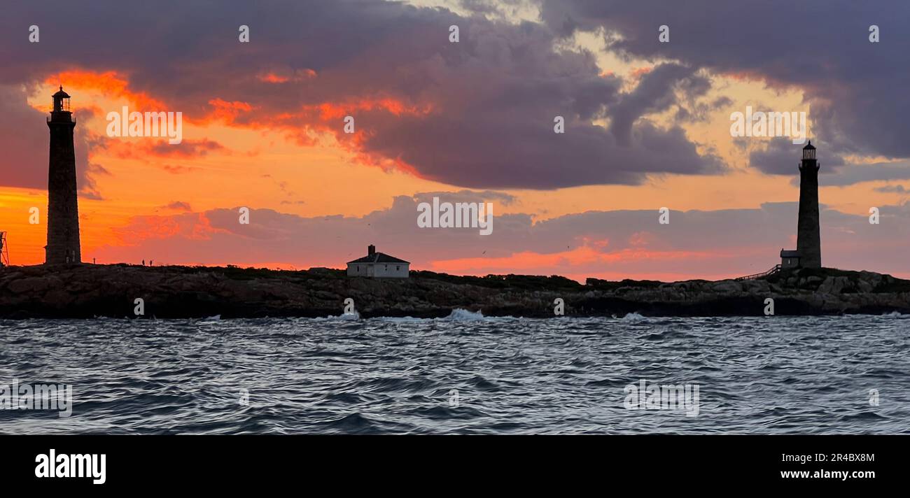An aerial view of sea waves in background of stony lighthouses during ...