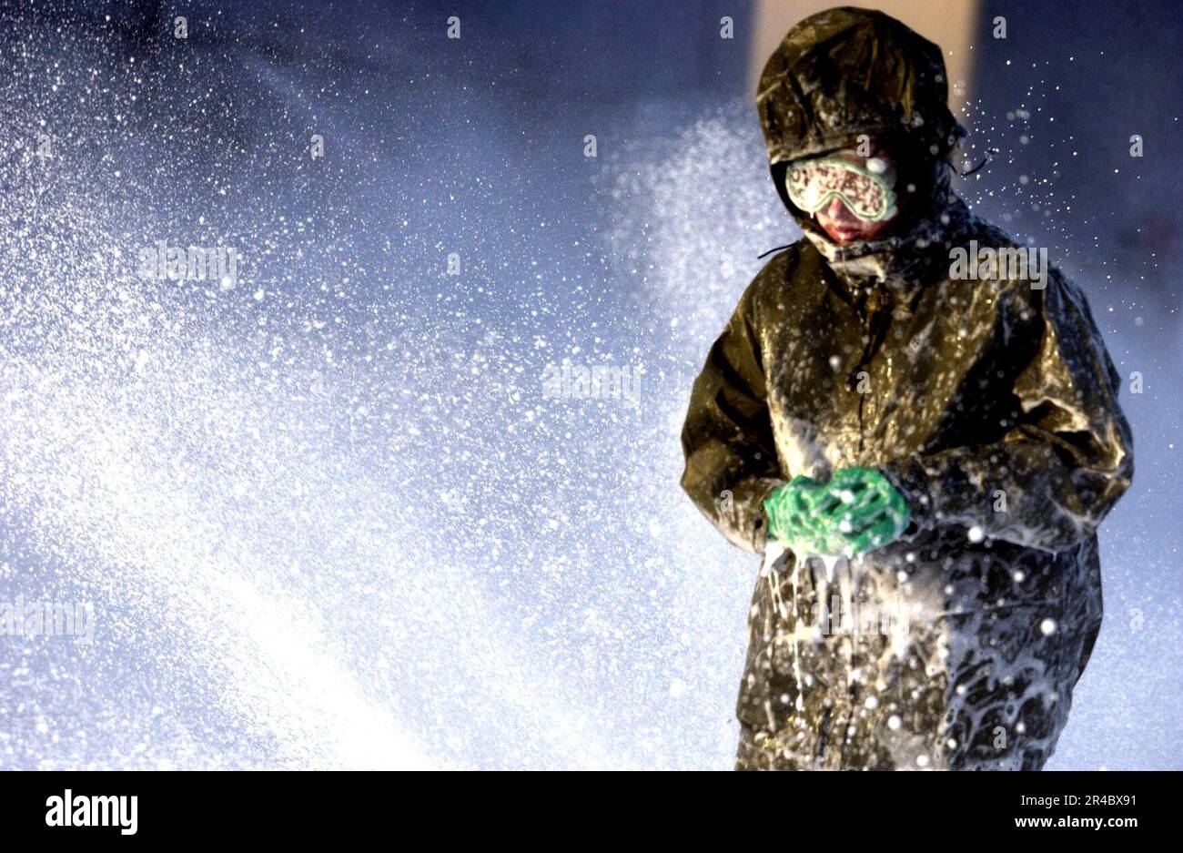 US Navy Damage Controlman Fireman collects samples of Aqueous Film ...