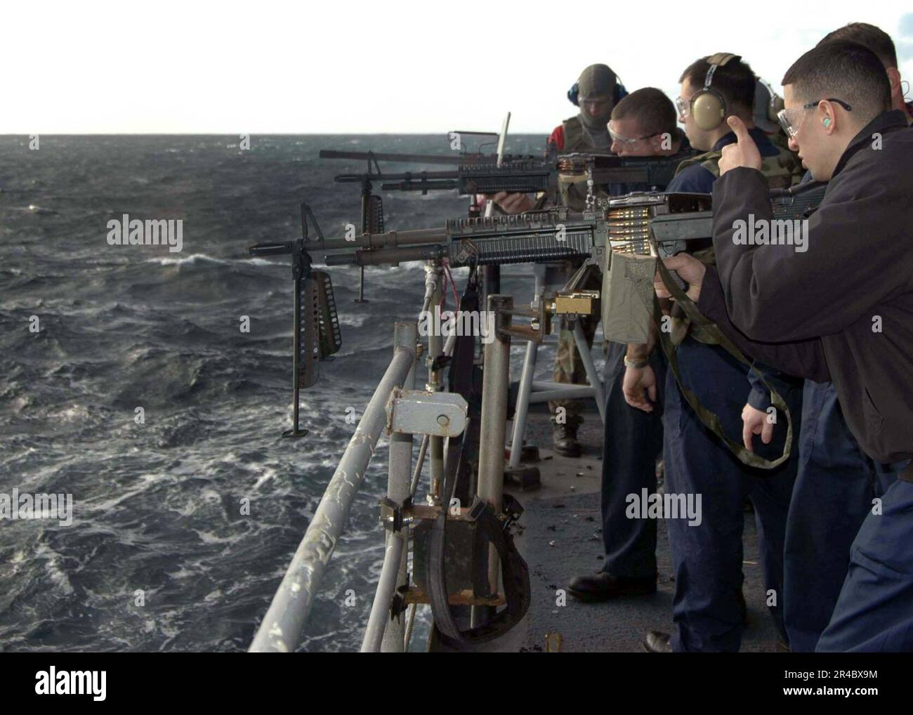 US Navy Sailors conduct a familiarization fire (FAMFIRE) aboard the ...