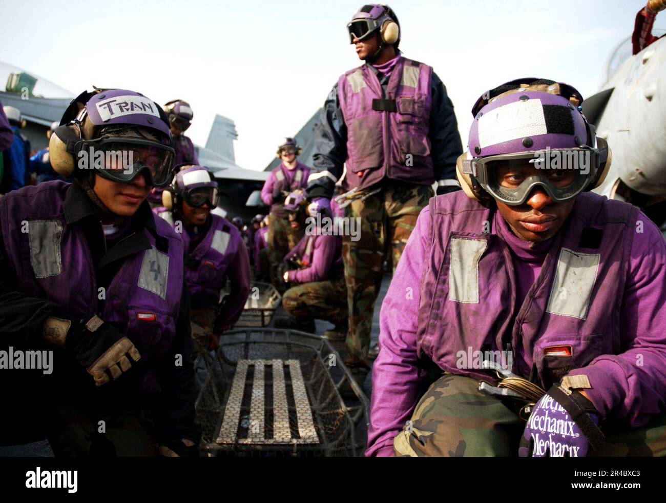 US Navy Flight deck personnel participate in an aircraft fire drill on ...