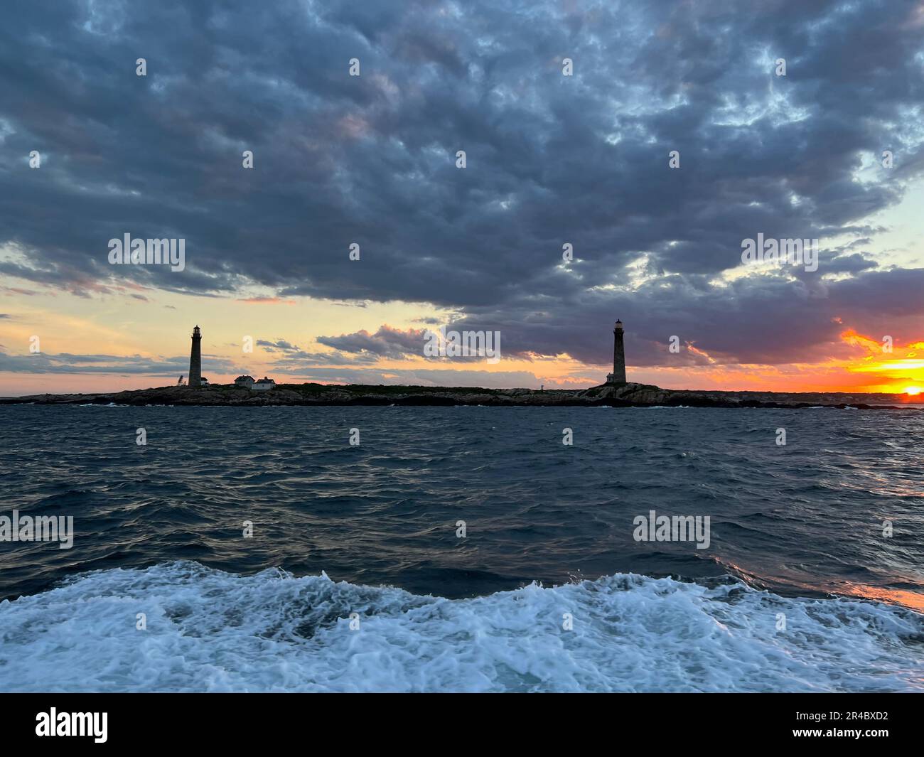 An aerial view of sea waves in background of stony lighthouses during ...