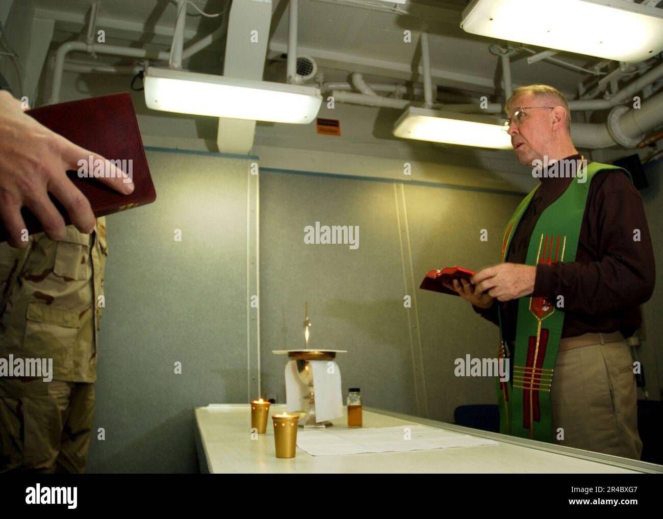 US Navy U.S. Navy Chaplain, Lt. Cmdr. conducts catholic mass services ...