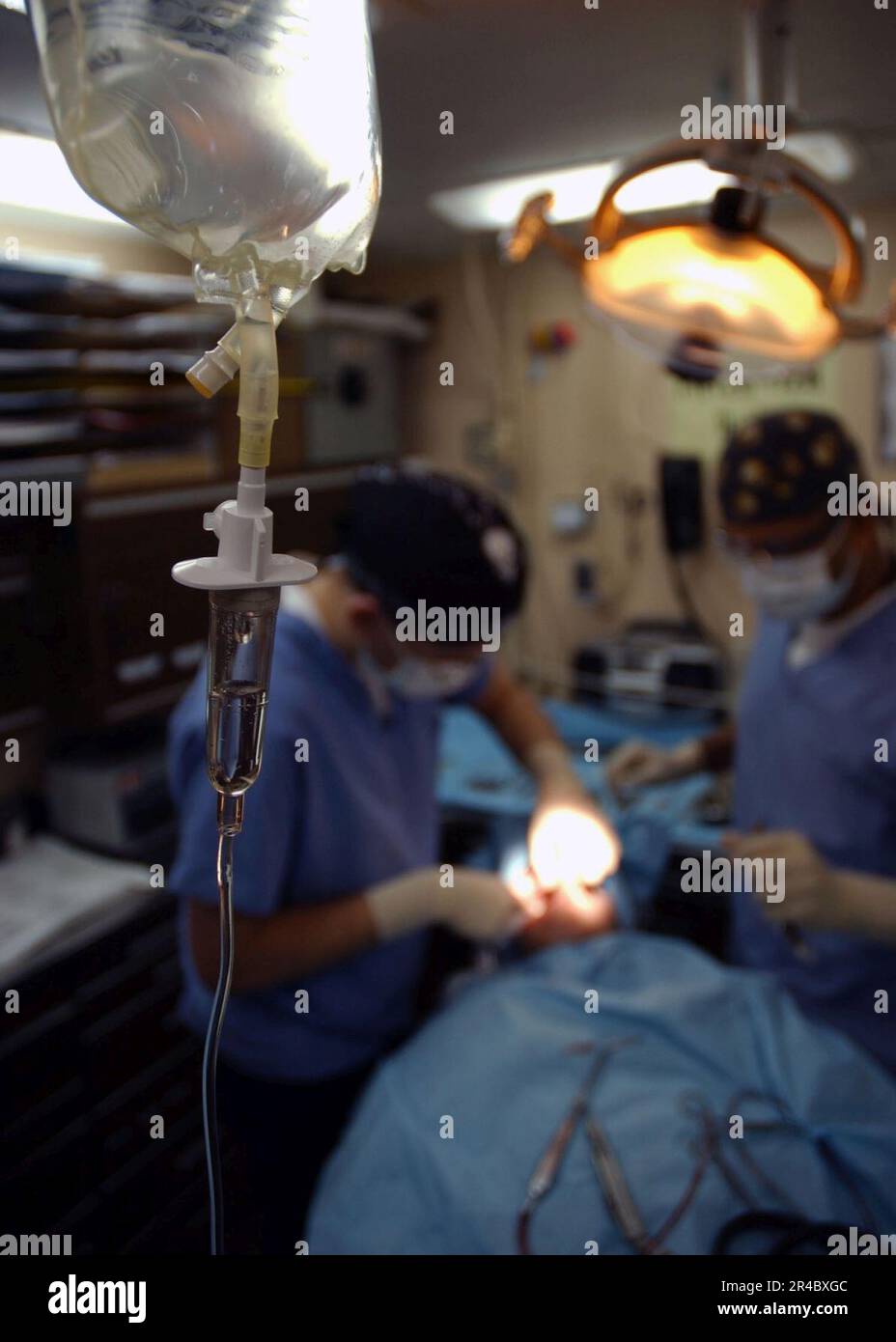 US Navy Lt. Cmdr. and Hospital Corpsman 2nd Class perform a wisdom ...