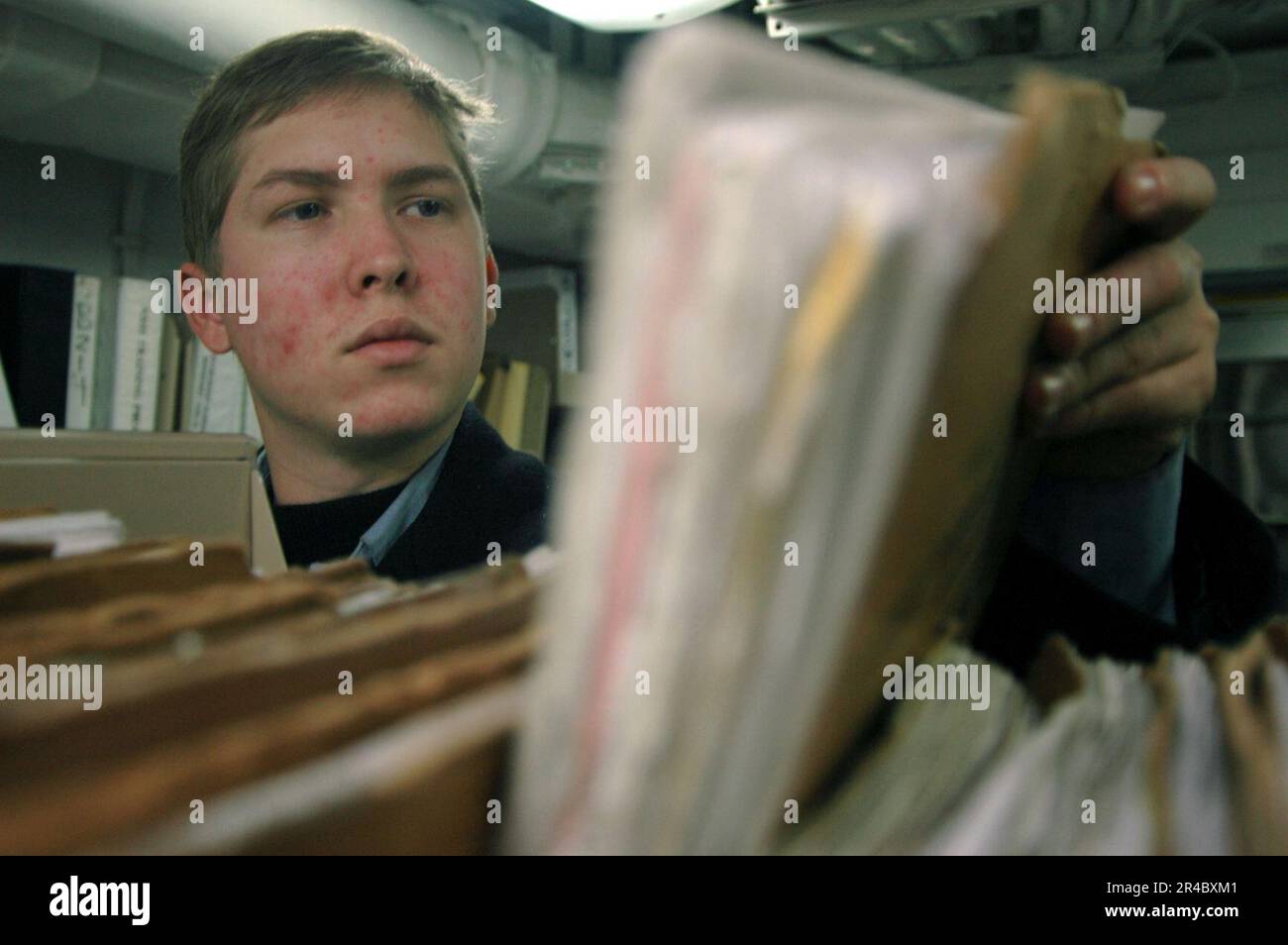 US Navy Personnel Specialist 3rd Class researches service records on ...