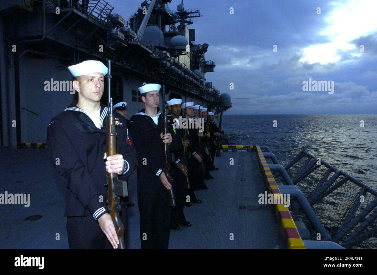 US Navy A ceremonial rifle team stands at a port arms ready to render ...