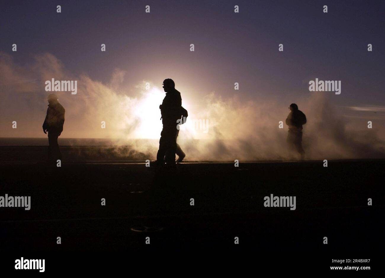 US Navy Crew members clear the shot line to prepare for another launch ...