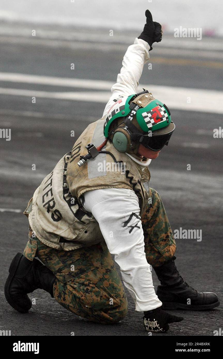 US Navy A line captains gives the ready signal for launch Stock Photo ...