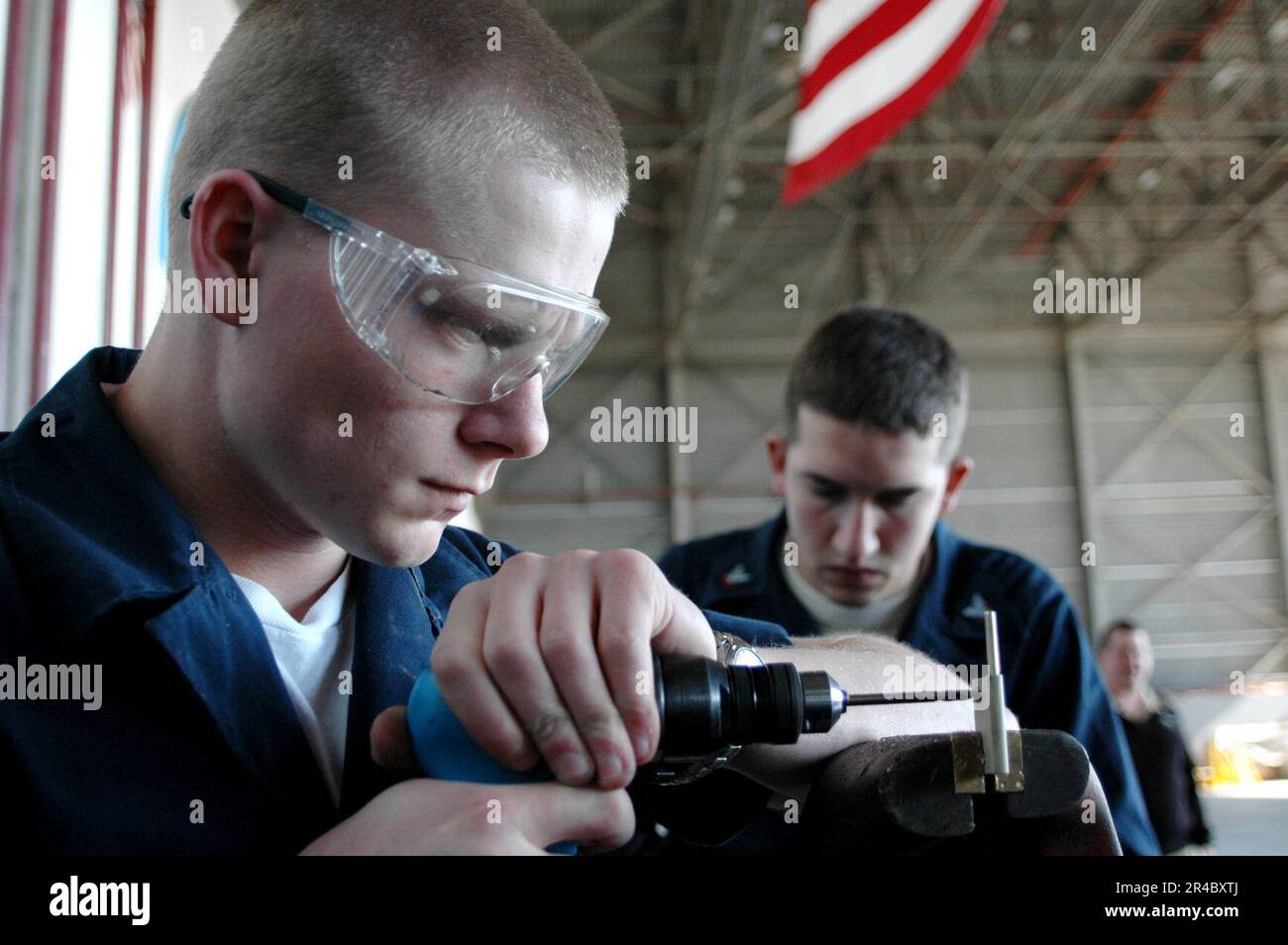 US Navy Aviation Structural Mechanic Airman assigned to the Rawhides of ...
