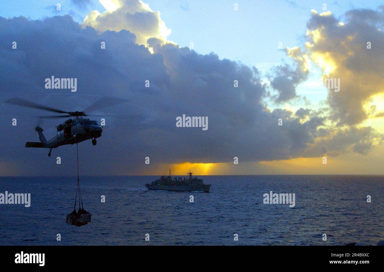 US Navy An MH-60S Seahawk helicopter delivers supplies during a ...