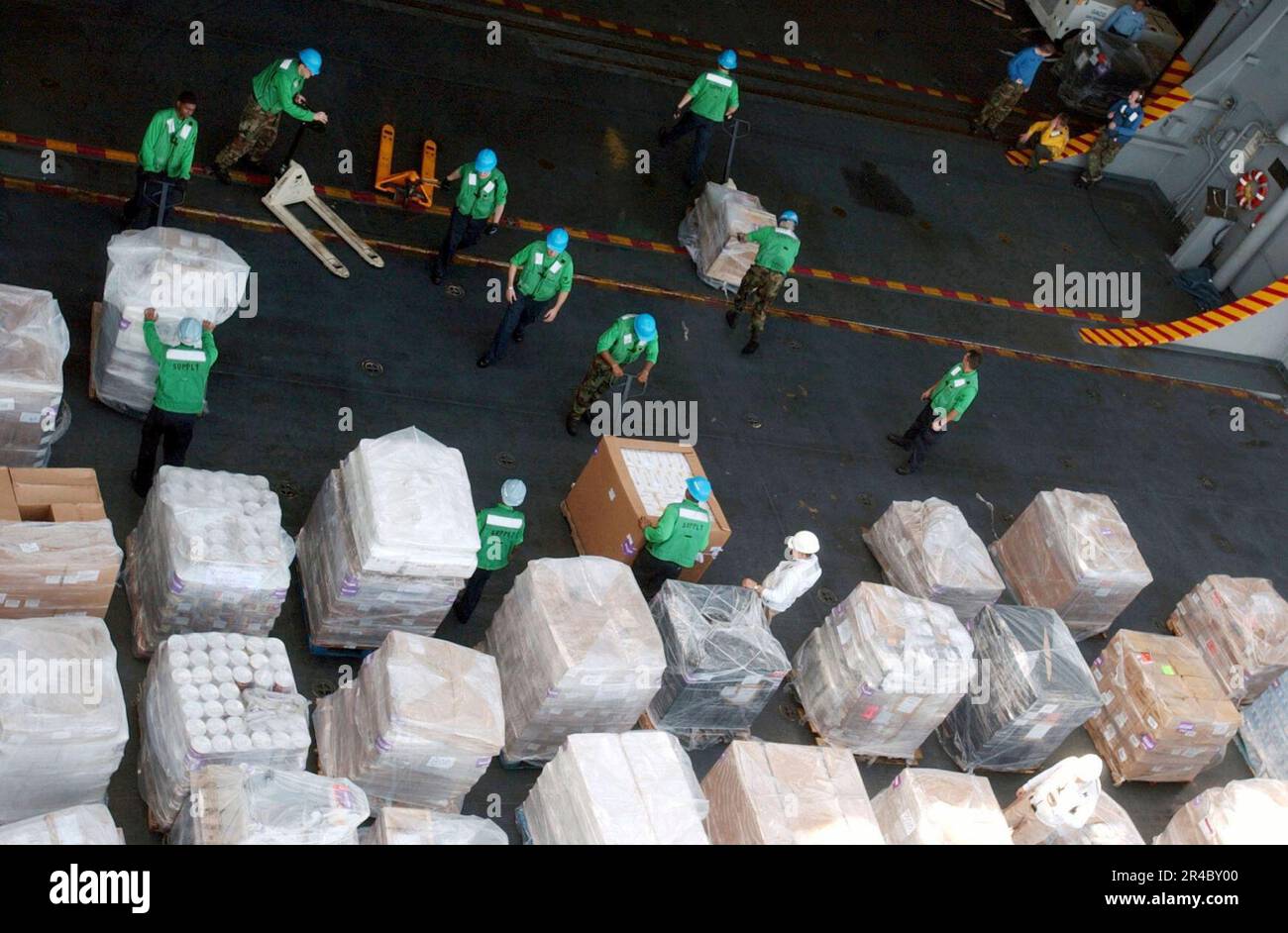 US Navy Sailors stationed aboard the Nimitz-class aircraft carrier USS ...