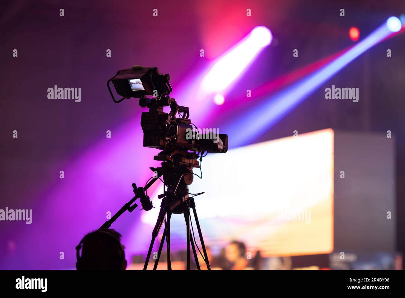 Filming the stage during the gaming festival with TV camera. Mid shot ...