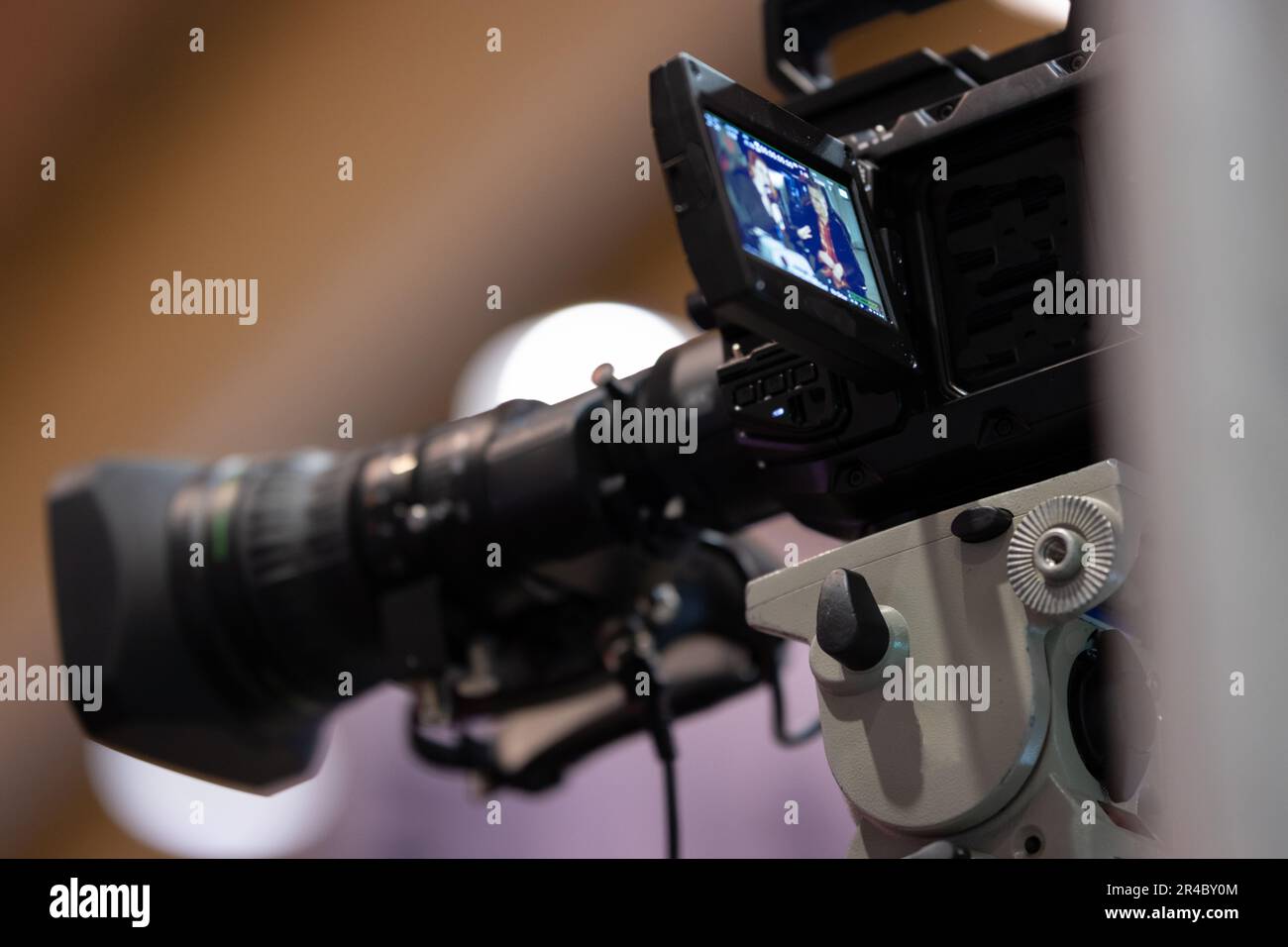 The camera shoots an interview with two people. Mid shot Stock Photo ...