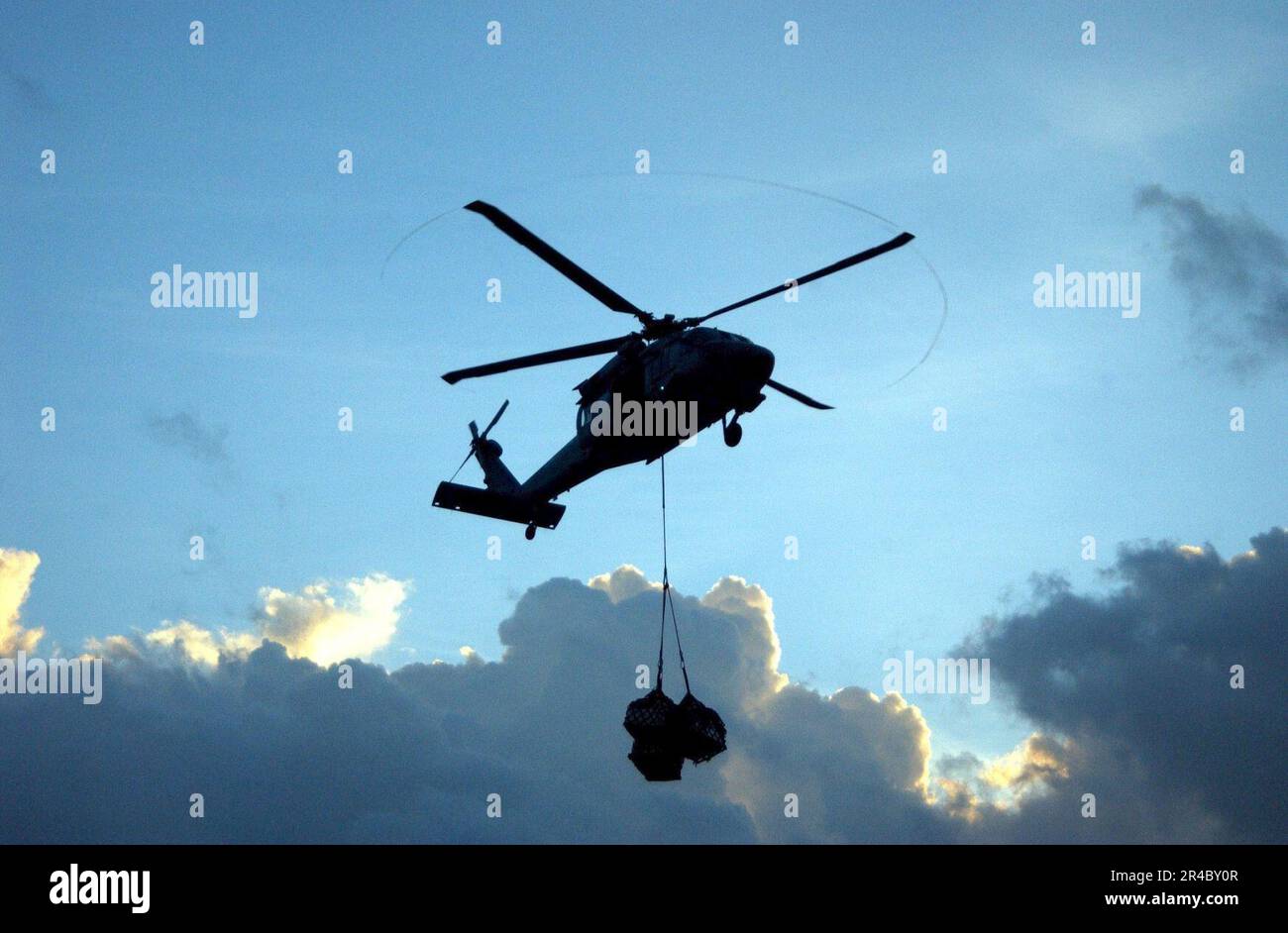 US Navy An MH-60S Seahawk helicopter delivers supplies from the ...