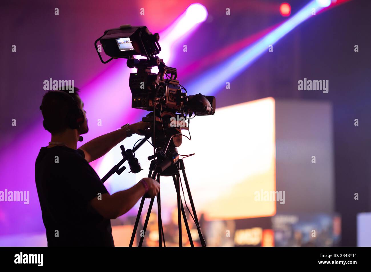 The man behind the camera shooting the stage during the gaming festival ...