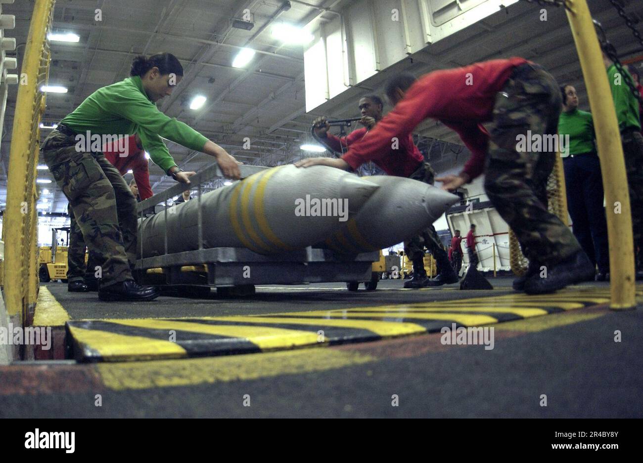 US Navy Sailors reposition a palette of 2000 pound general-purpose ...
