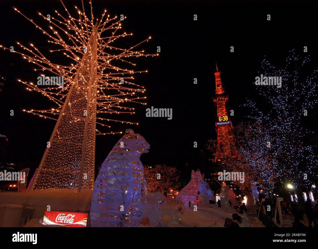 US Navy Illuminated trees and ice sculptures line the streets leading ...