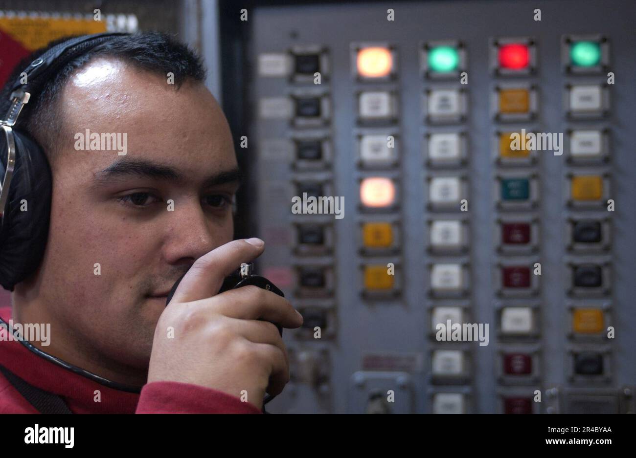 US Navy Aviation Ordnanceman Airman stands an elevator operator watch ...