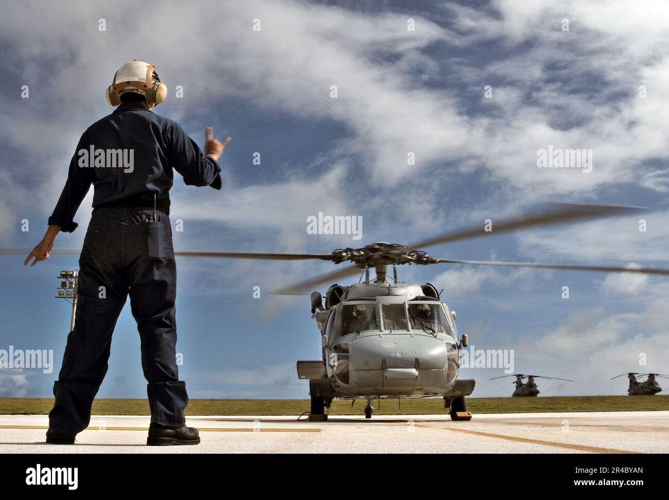 US Navy Airman gives the signal to start the second engine to the ...