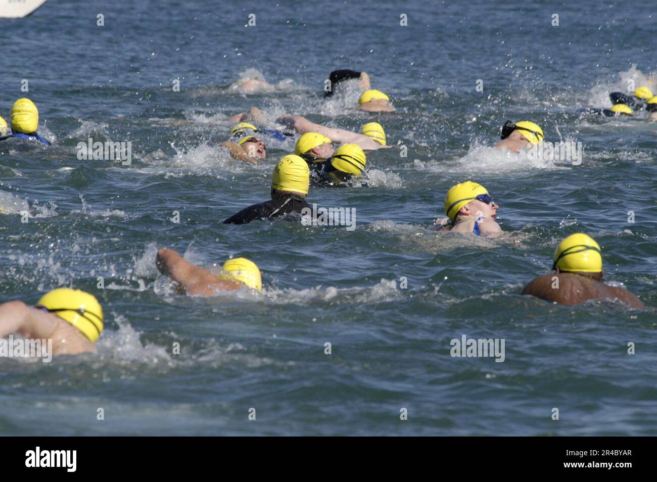 US Navy Sailors and civilians swim out into San Diego Bay during the ...