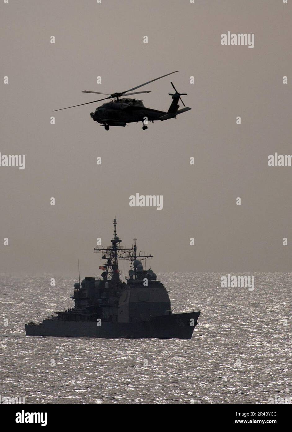 US Navy An SH-60F Seahawk performs plane guard duties as the guided ...