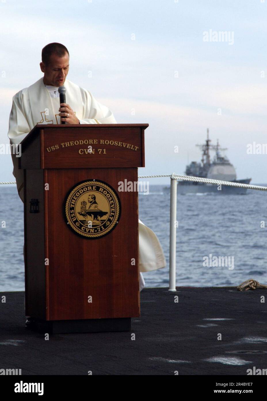 US Navy Chaplain, Comdr. conducts a burial at sea aboard the Nimitz ...