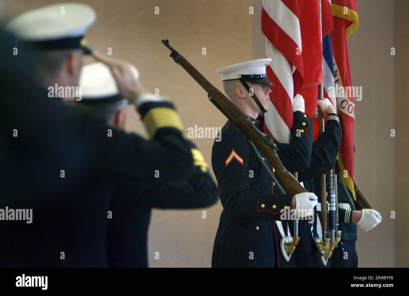 US Navy Color guard members march in place during the start of a full ...