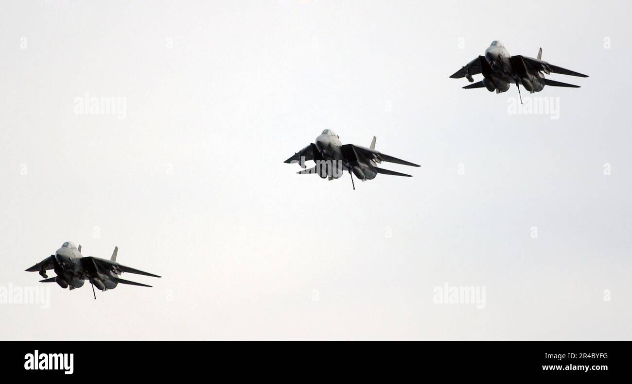 US Navy Three F-14D Tomcats perform a fly-by over the Nimitz-class ...