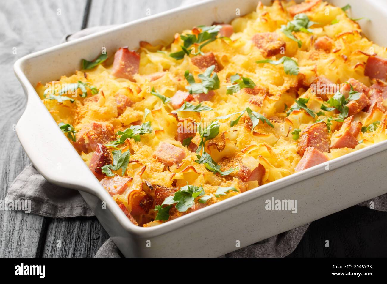 Baked Austrian ham pasta so called Schinkenfleckerl closeup on the ...