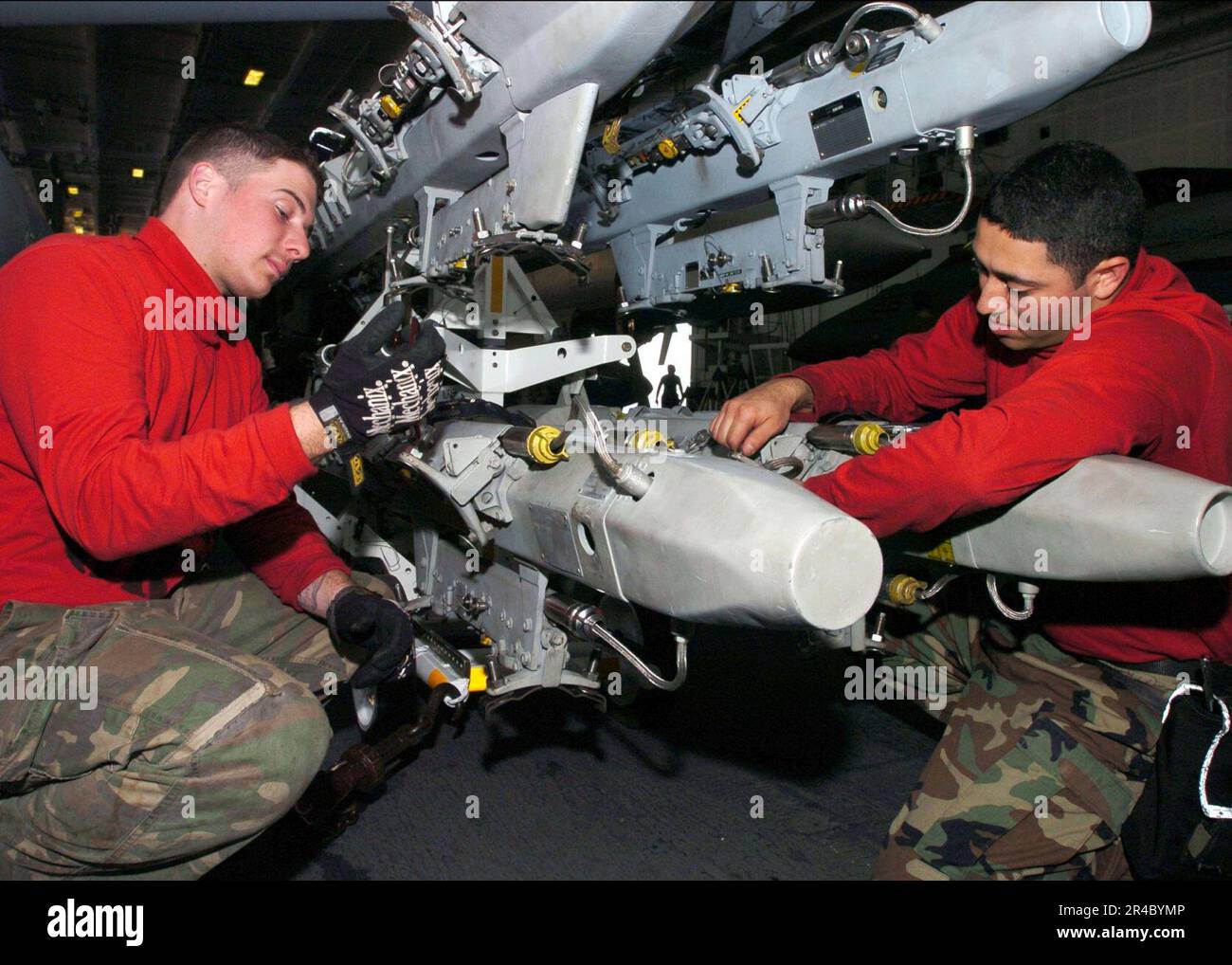 US Navy Aviation Ordnanceman ,change the armor brackets on an ...