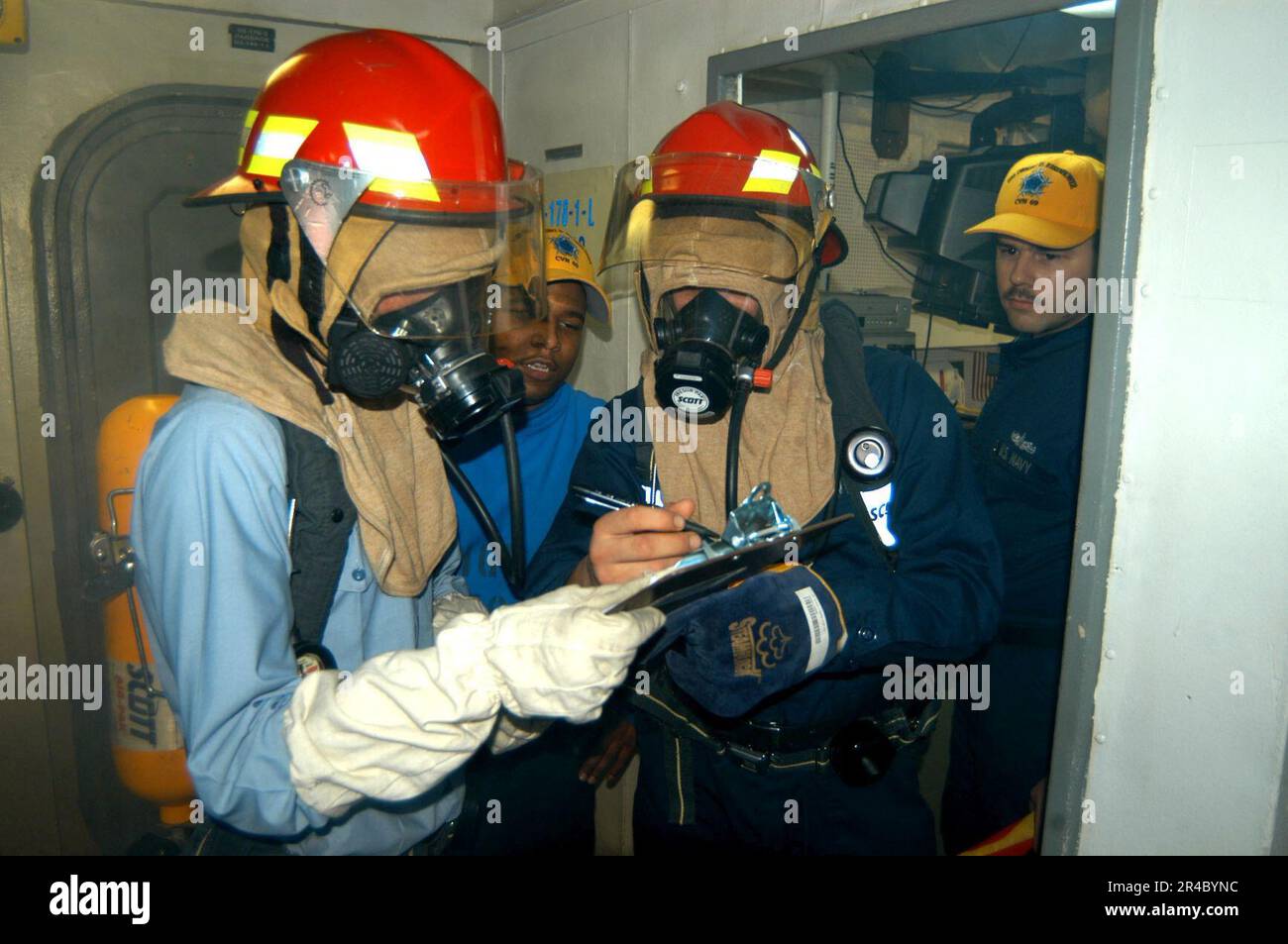 US Navy Sailors from Repair Locker Seven Bravo report the location of a ...
