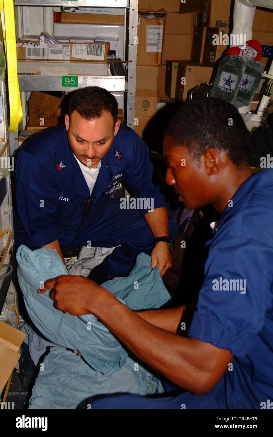 US Navy Hospital Corpsman inventory medical supplies aboard the dock ...