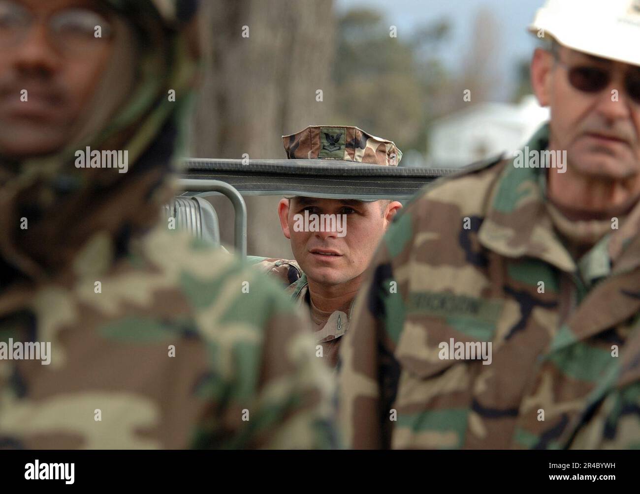 US Navy Builder 2nd Class stands at a Humvee prior to training with ...