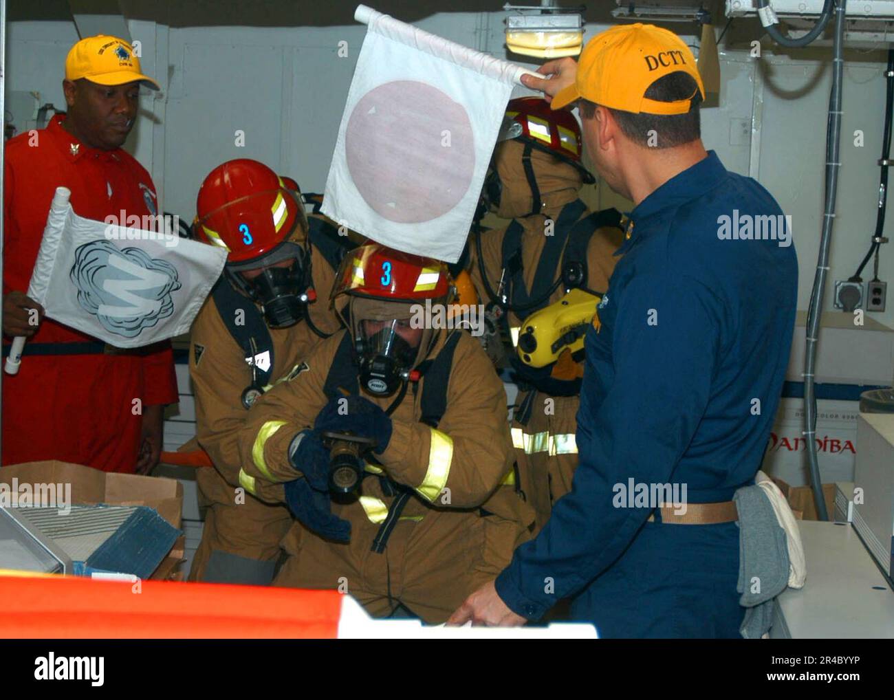 US Navy A firefighting hose team trains with the Damage Control ...