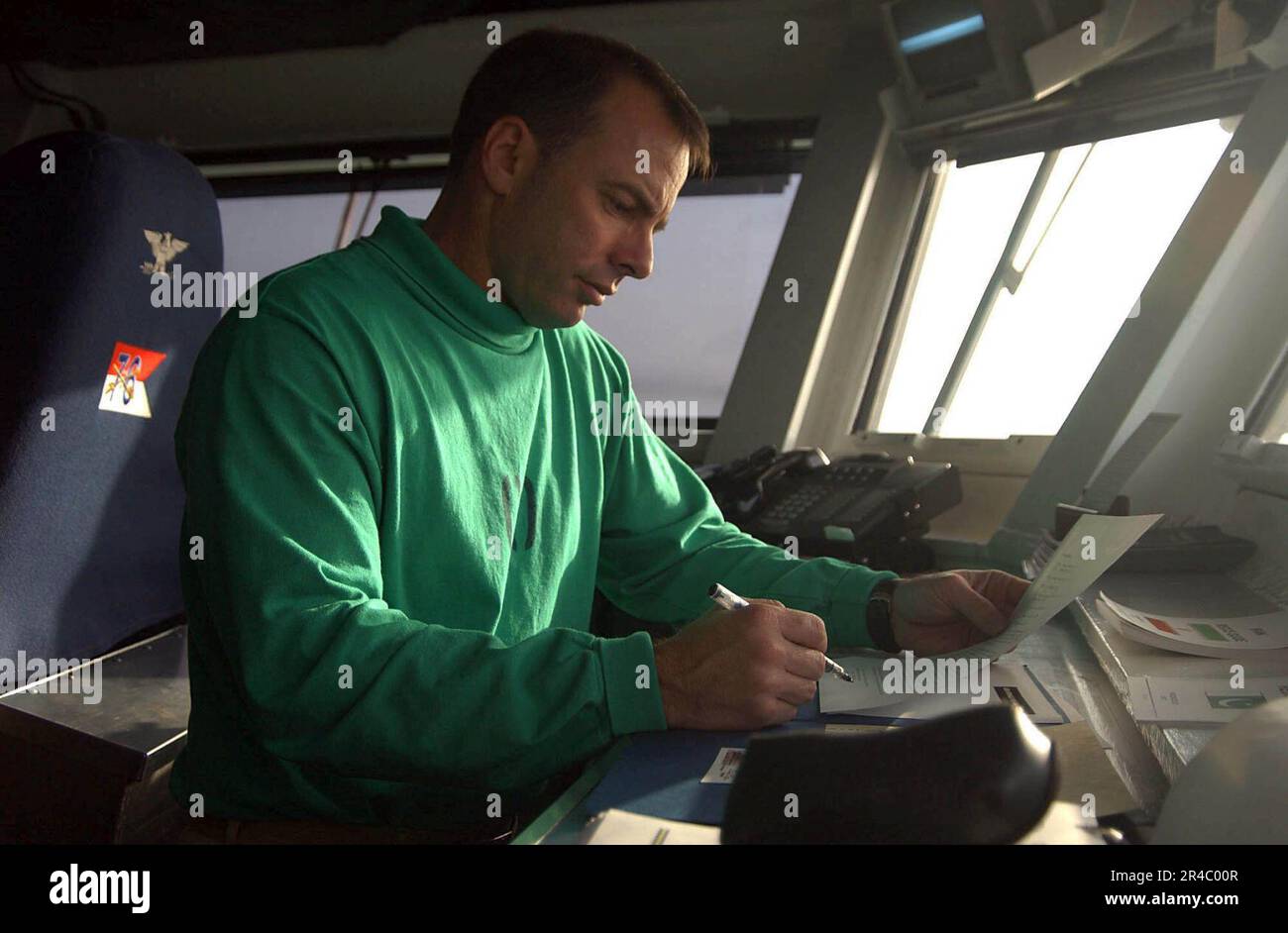 US Navy USS Ronald Reagan (CVN 76) Commanding Officer, Capt. reads ...